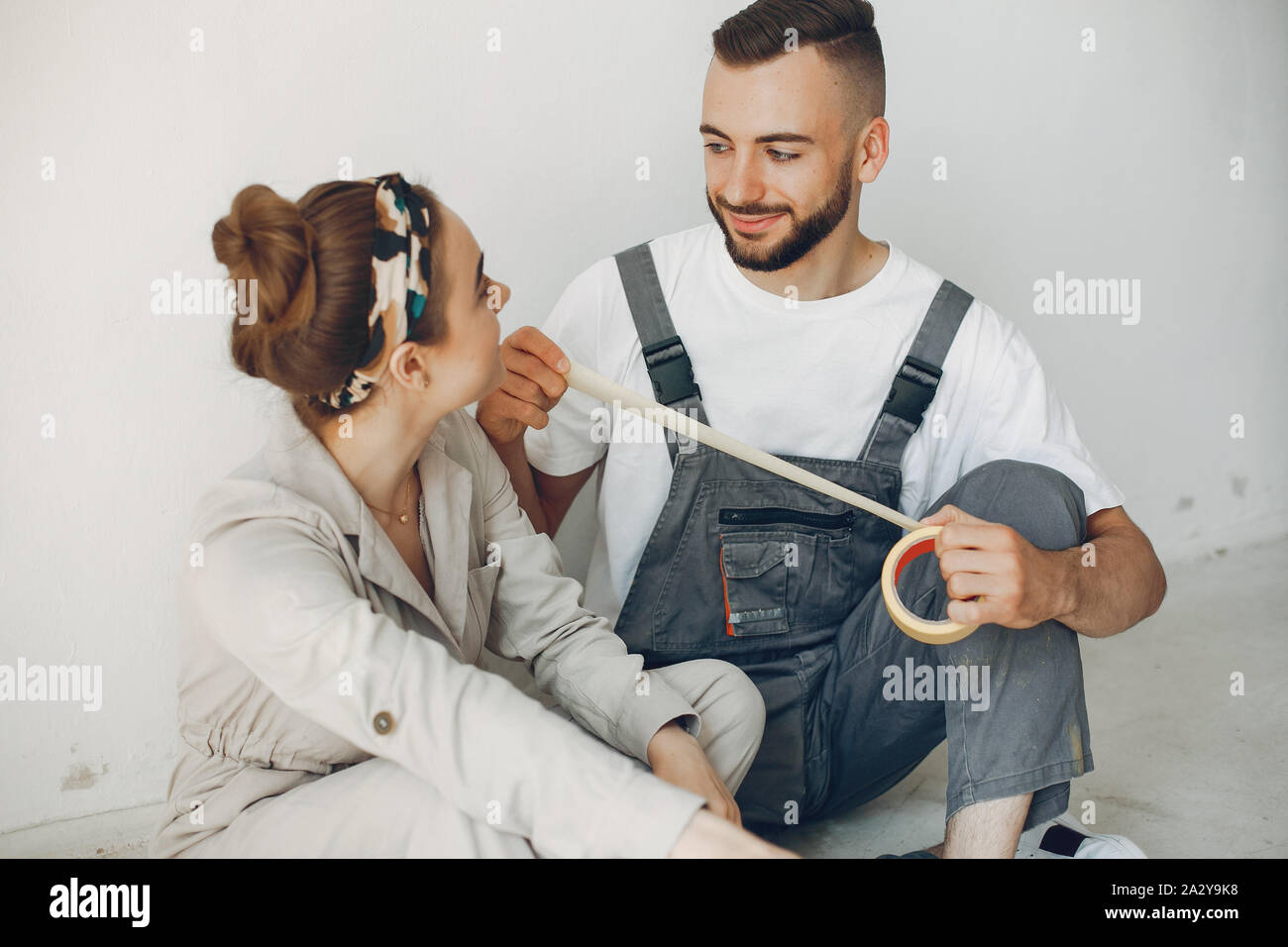 Happy woman in overalls hi-res stock photography and images - Alamy