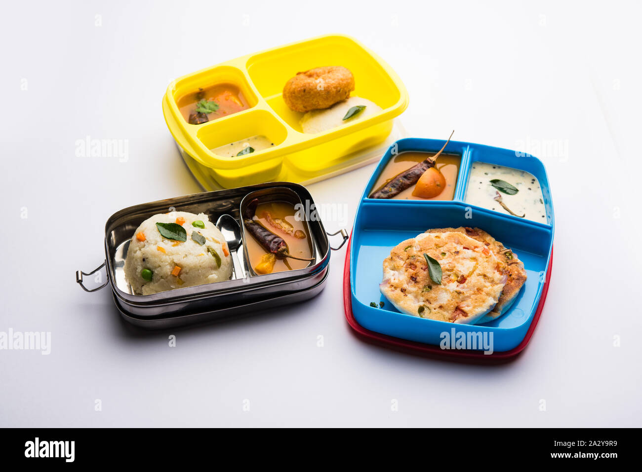 Assorted South Indian tiffin / lunch box food in group, includes idli ...