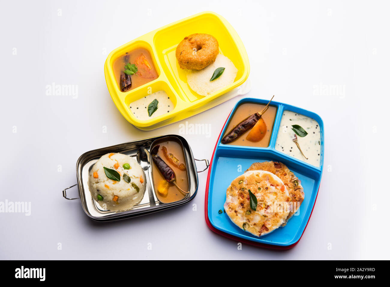 Assorted South Indian tiffin / lunch box food in group, includes idli ...