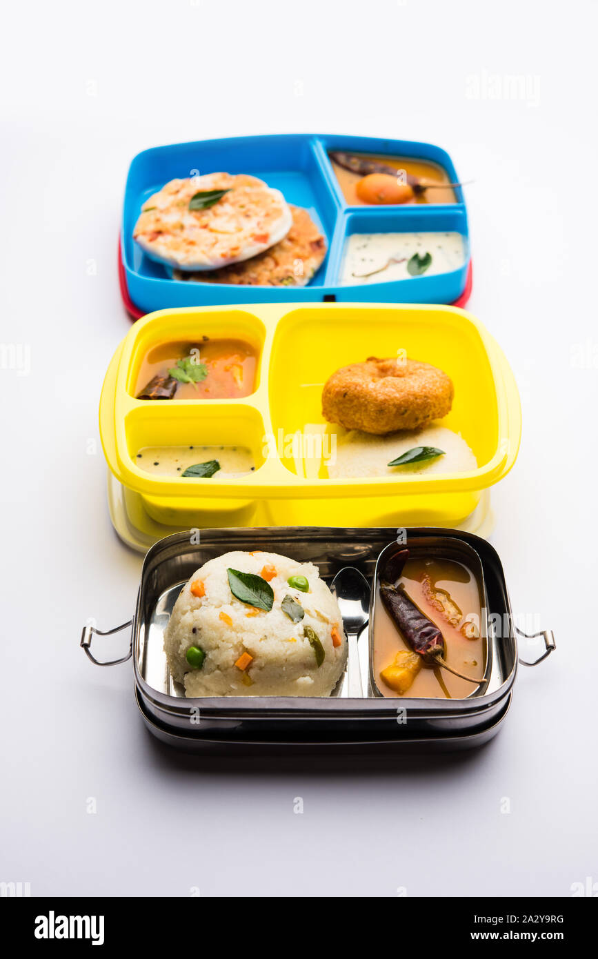 Assorted South Indian tiffin / lunch box food in group, includes idli ...