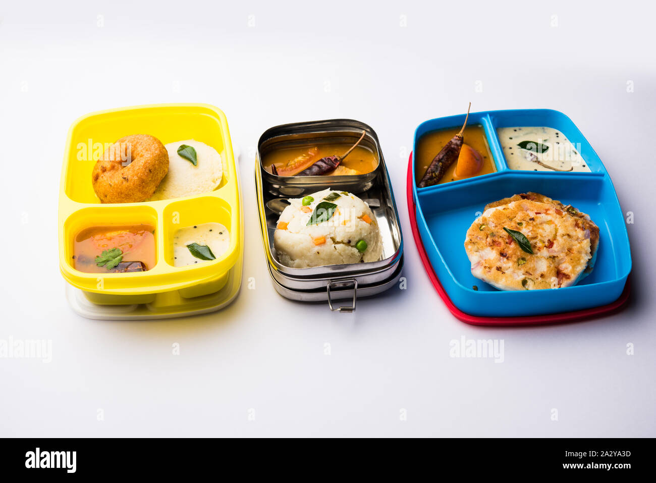 Assorted South Indian tiffin / lunch box food in group, includes idli ...