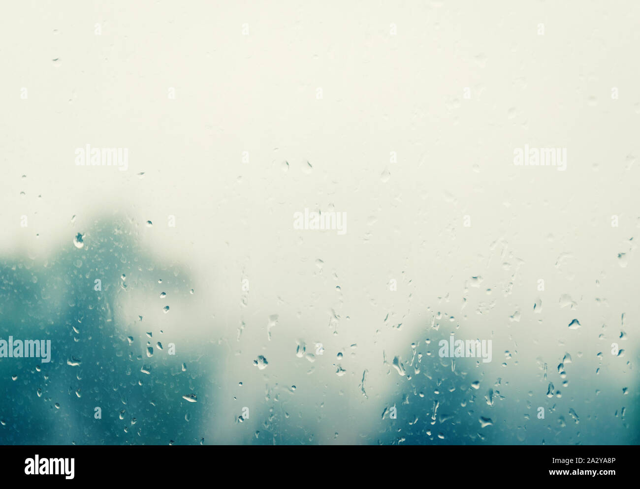 Bad weather, raindrops on the window, green background Stock Photo - Alamy
