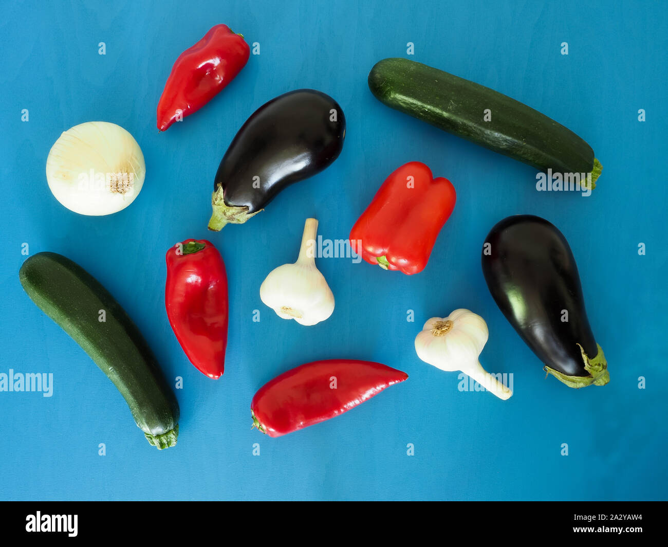 different types of healthy colorful vegetables on a turquoise wooden ...