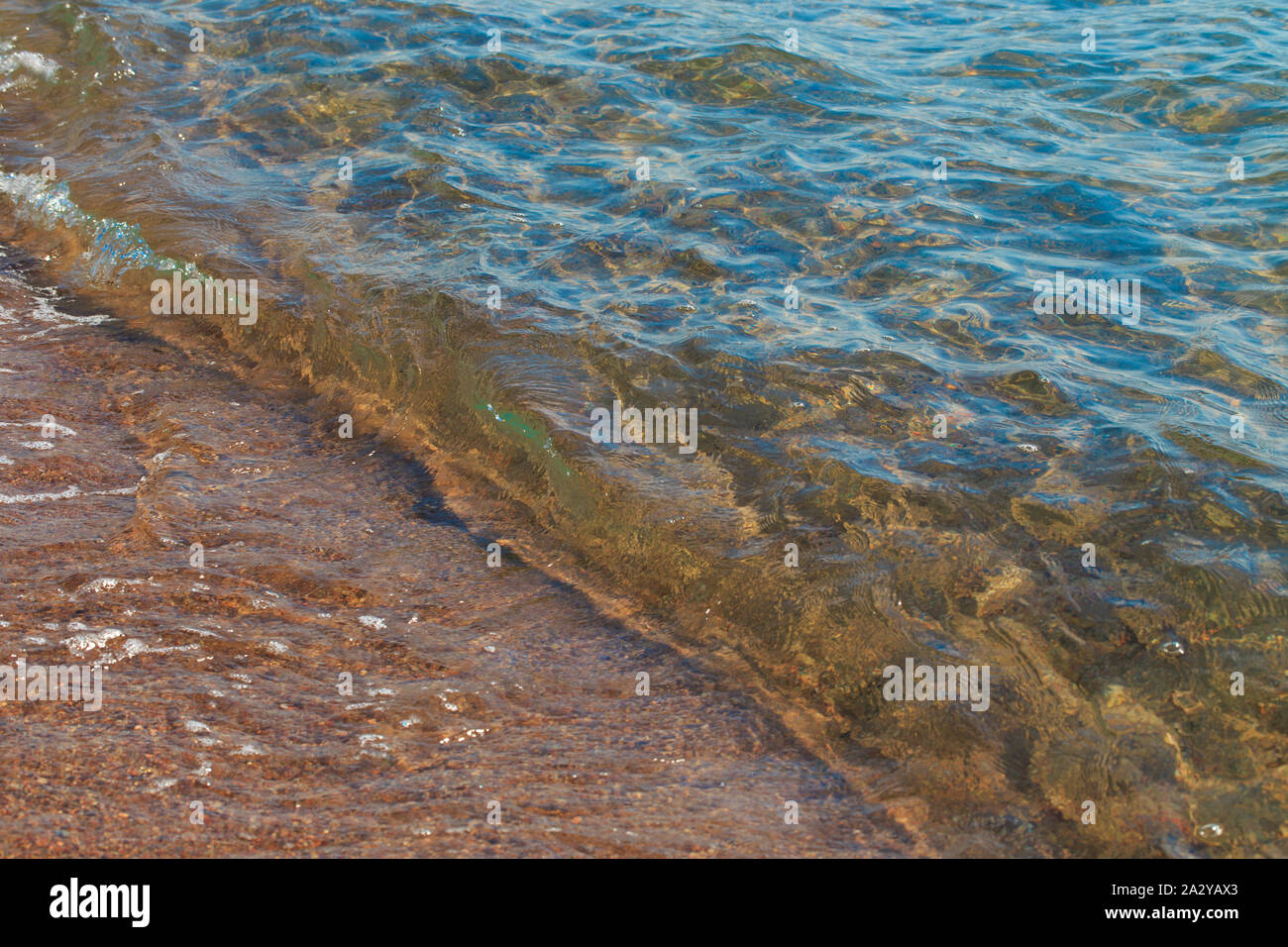 Clear water texture in blue and orange. Background of the ocean and the ...