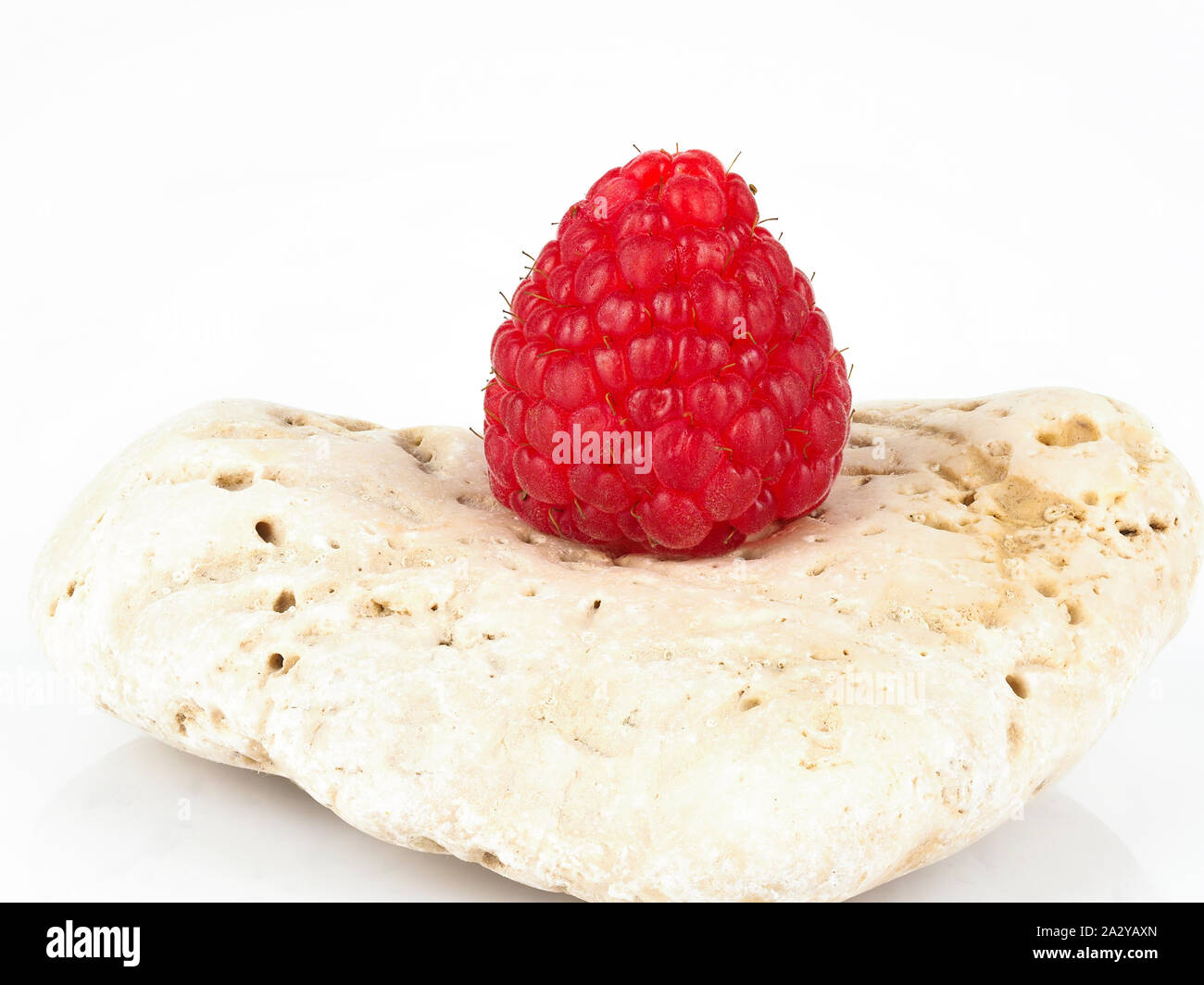 macro photo of a big raspberries on a white marble stone with white ...