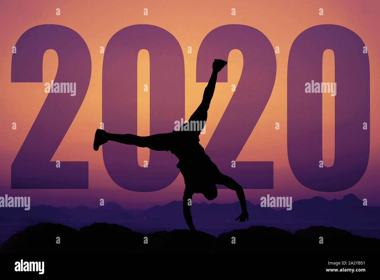 Dancer silhouette with big new year 2020 and sunset as symbol for ...
