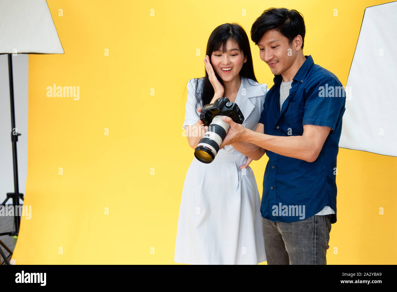 Behind the scenes, photographers are checking pictures with beautiful ...