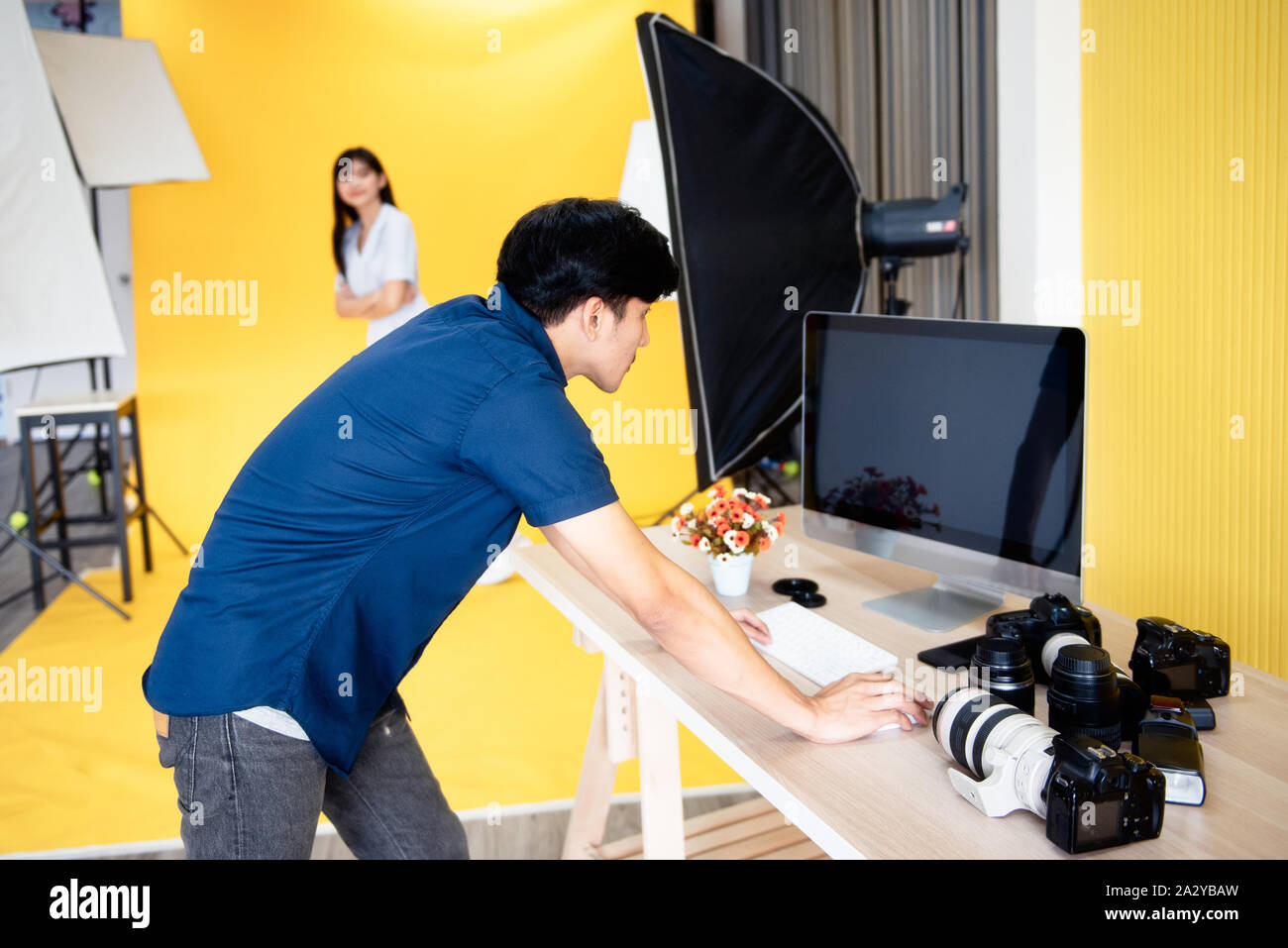 Behind the scenes, photographers are checking pictures with beautiful ...