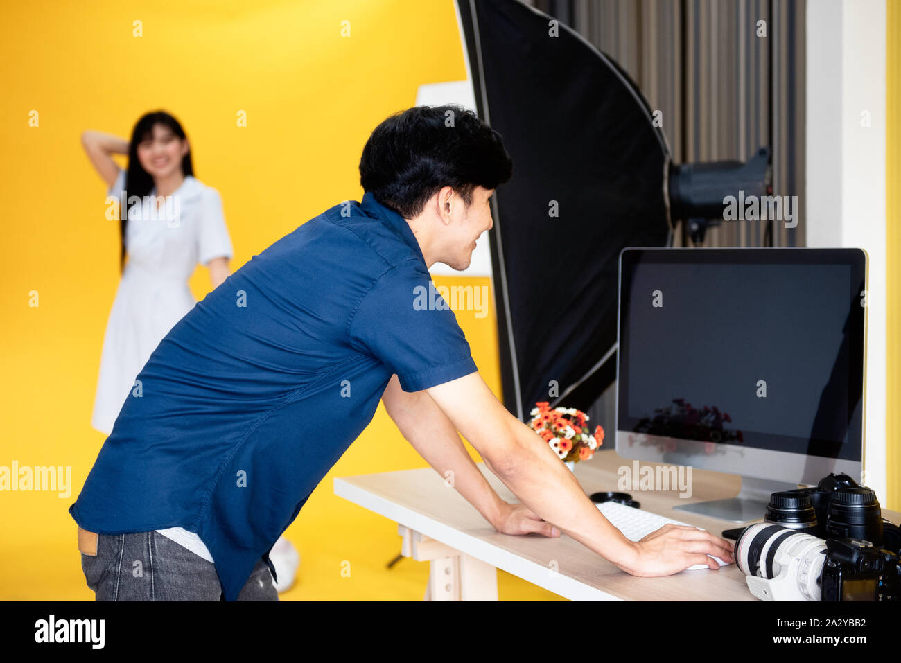 Behind the scenes, photographers are checking pictures with beautiful ...