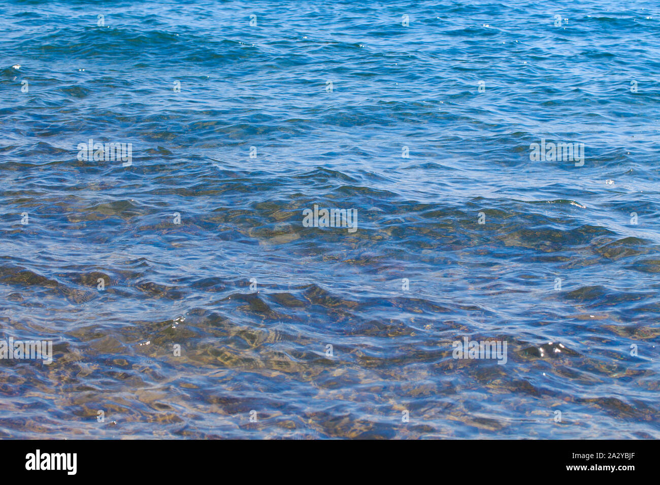 Clear water texture in blue and orange. Background of the ocean and the ...