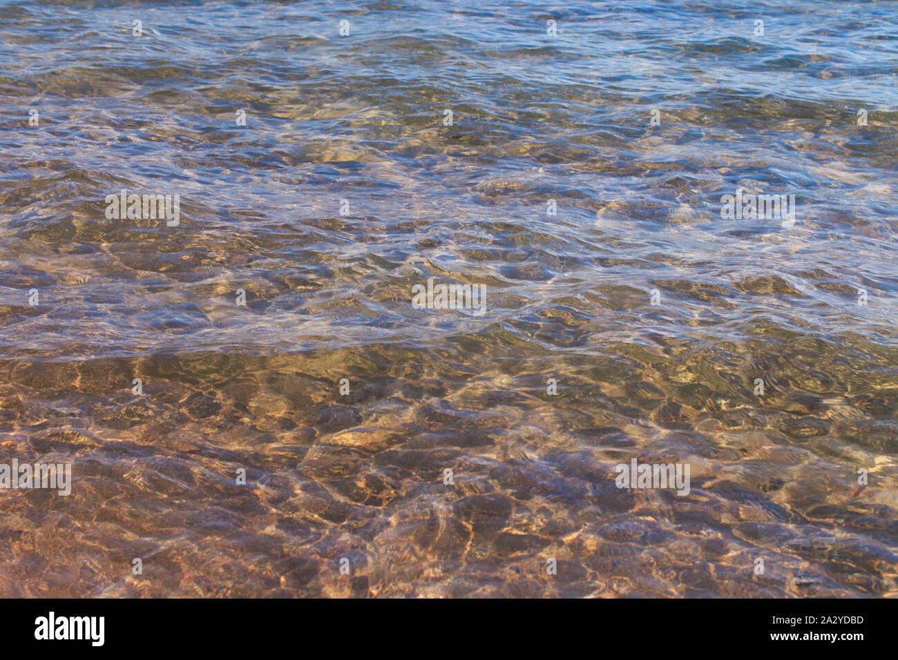 Clear water texture in blue and orange. Background of the ocean and the ...