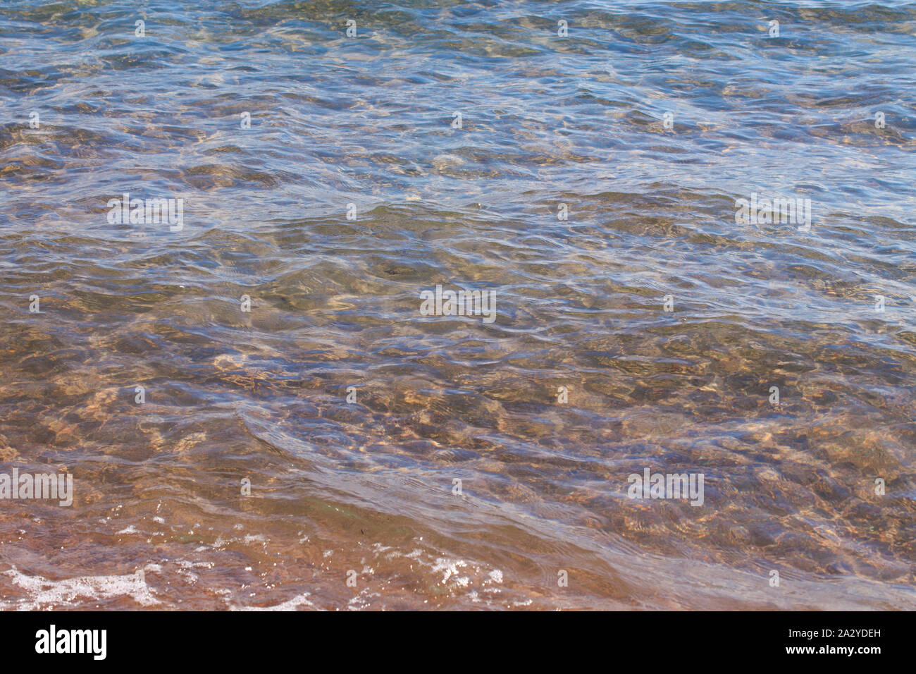 Clear water texture in blue and orange. Background of the ocean and the ...