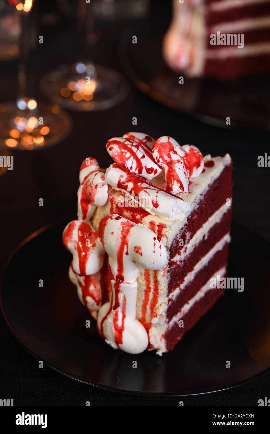 A piece of creepy cake (red velvet), decorated with meringue bones and ...