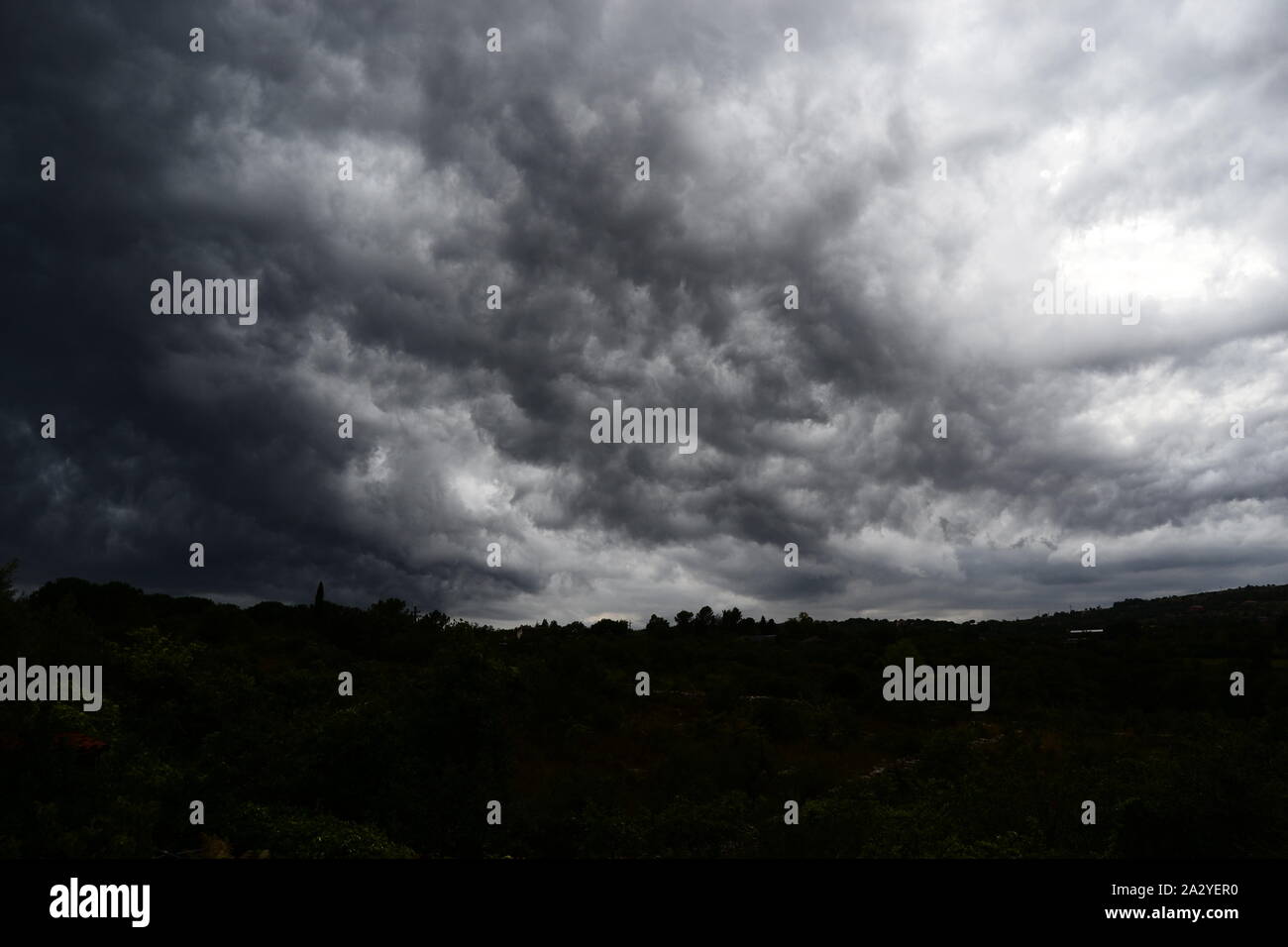 Thundercloud supercell seen from below, gray storm clouds Stock Photo ...
