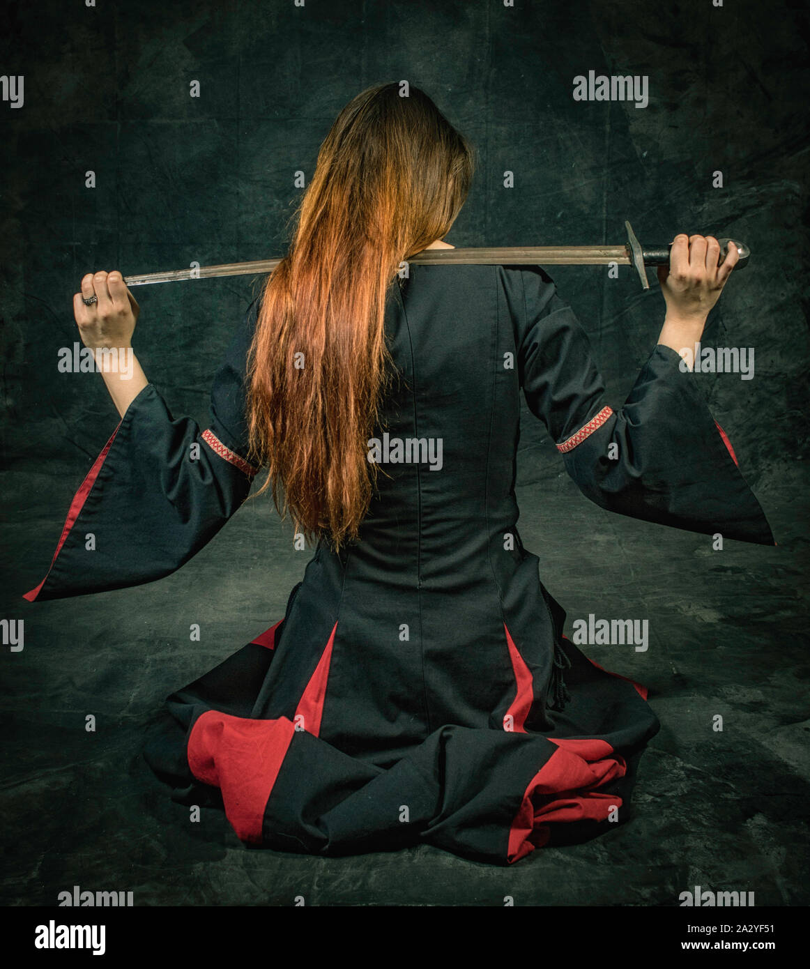 full length portrait of young long haired woman wearing a medieval ...
