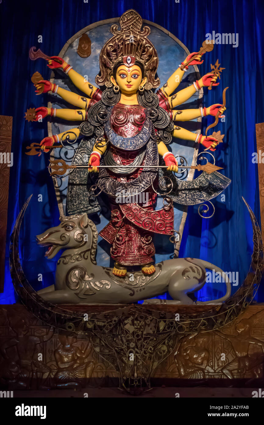 Goddess Durga idol at decorated Durga Puja pandal, shot at colored ...