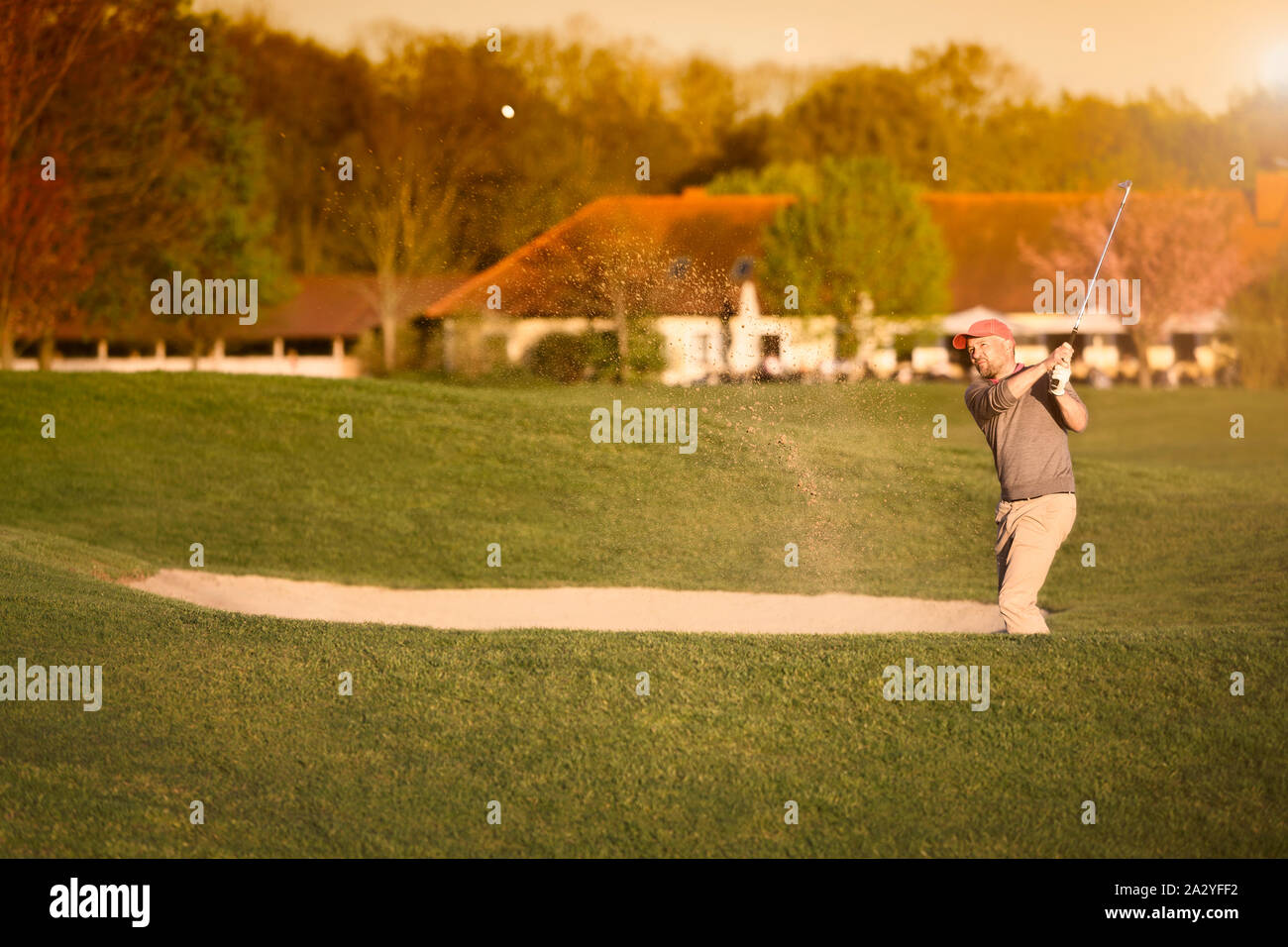 Active golfer at bunker Stock Photo - Alamy
