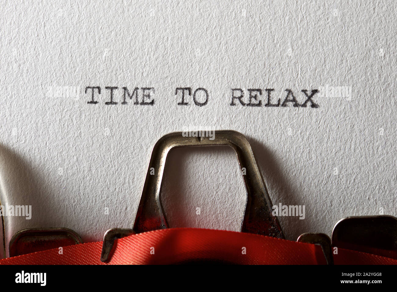 The sentence, Time to relax, written with a typewriter Stock Photo - Alamy