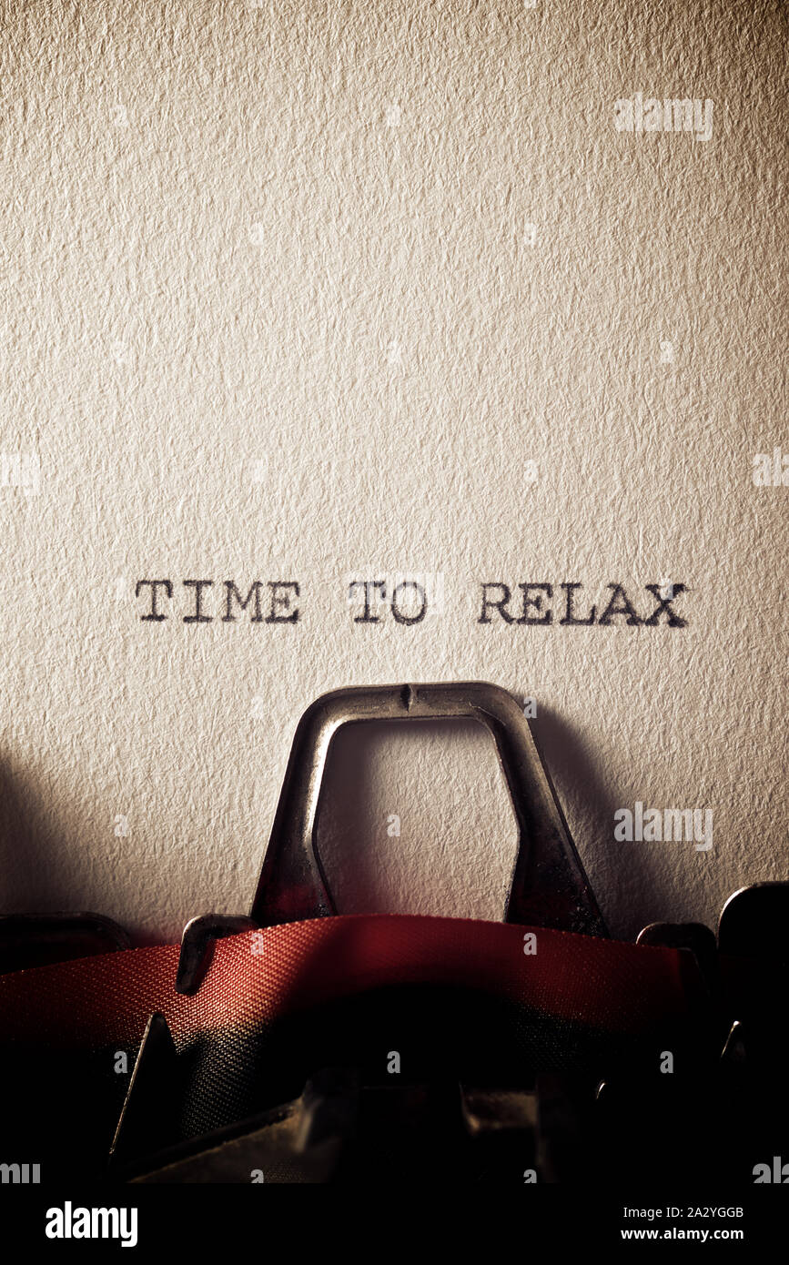 The sentence, Time to relax, written with a typewriter Stock Photo - Alamy