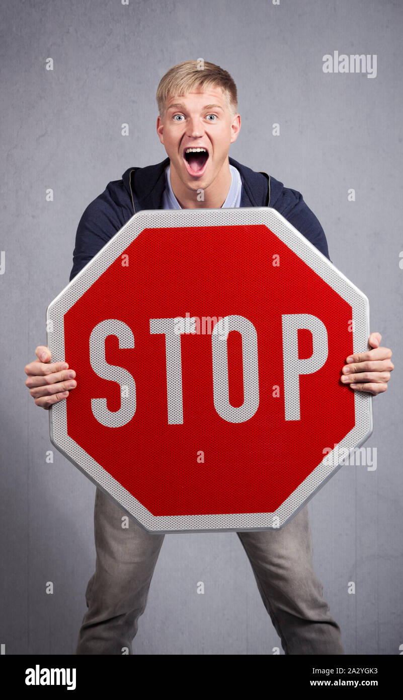 Alert man showing stop sign Stock Photo - Alamy