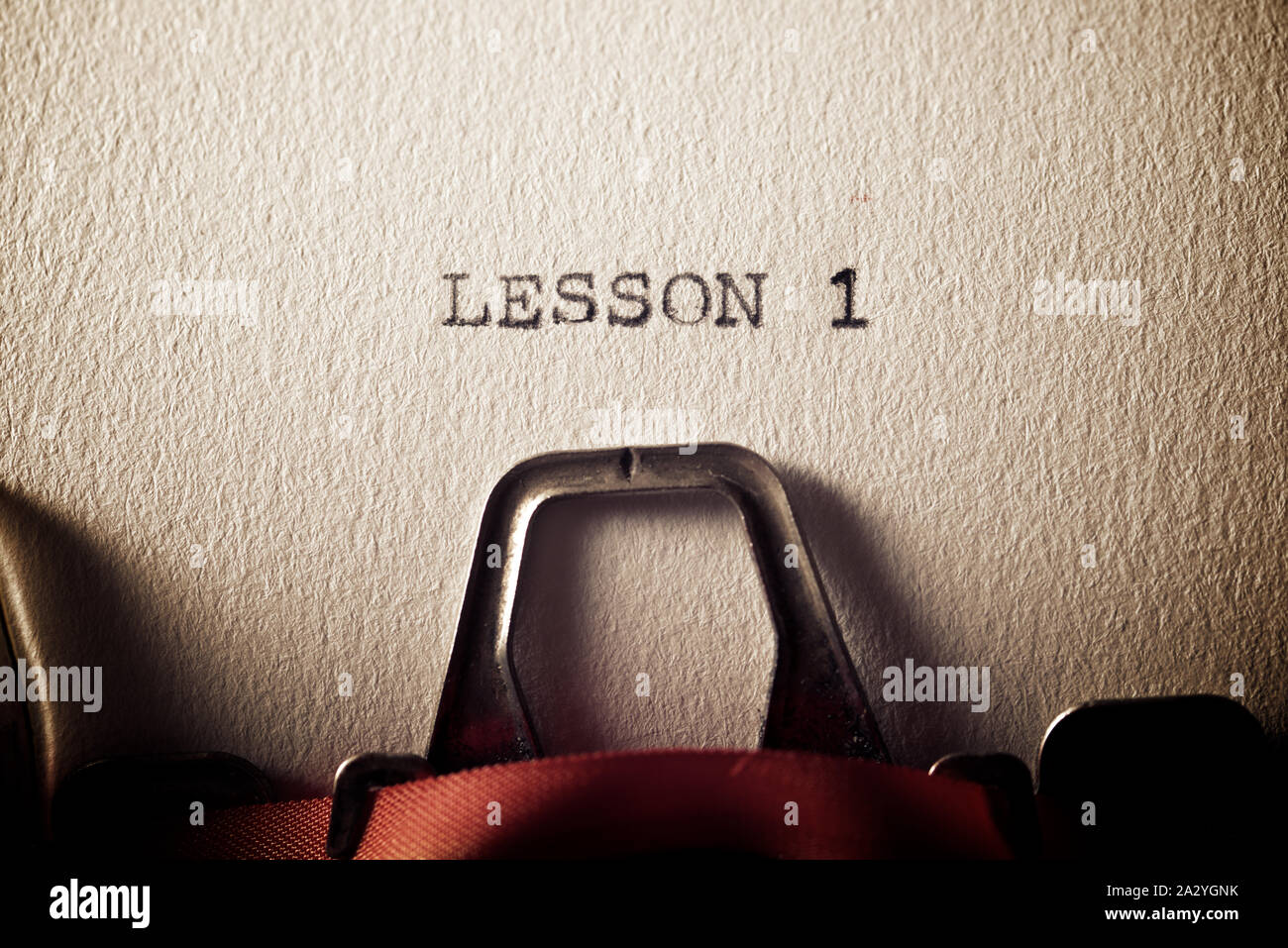 The sentence, Lesson 1, written with a typewriter Stock Photo - Alamy