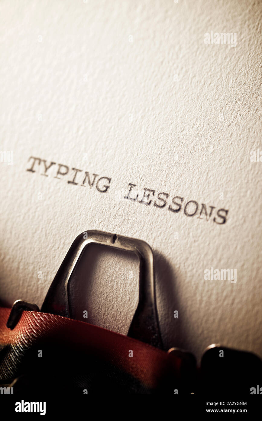 The sentence, Typing Lessons, written with a typewriter Stock Photo - Alamy
