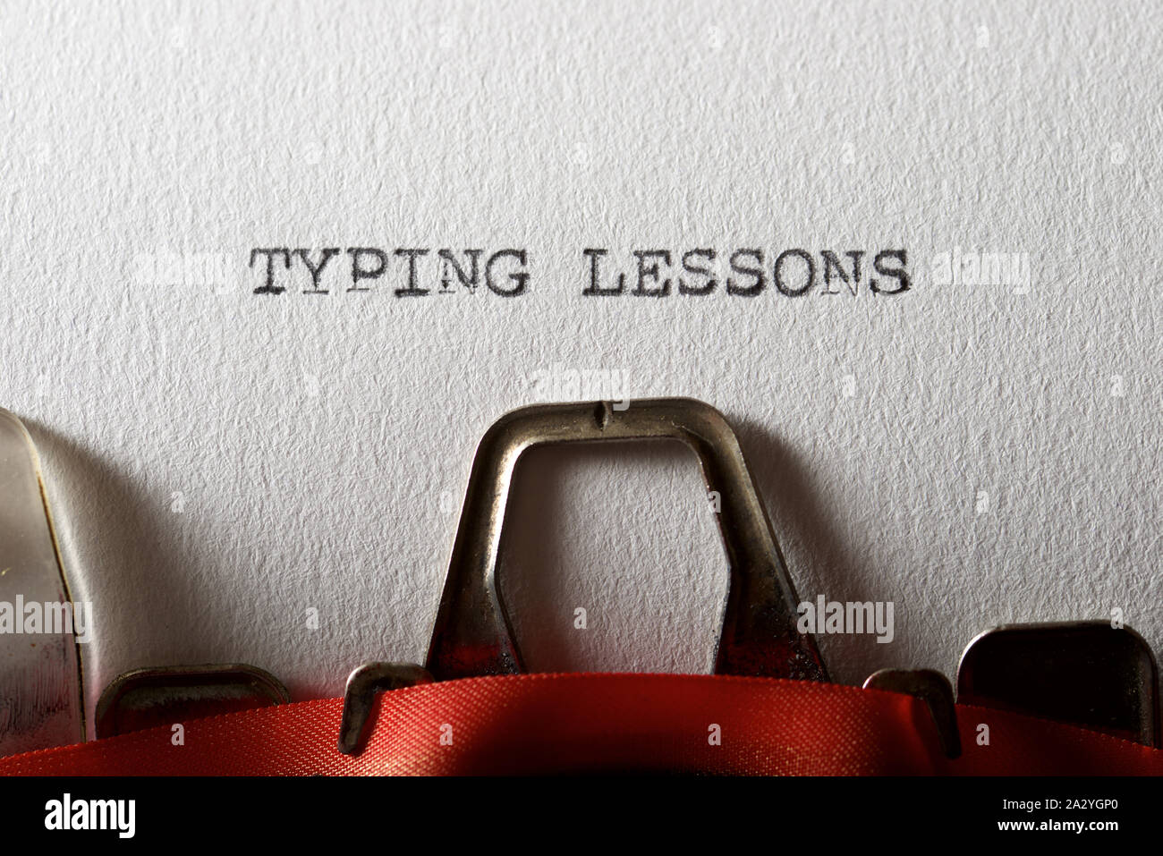 The sentence, Typing Lessons, written with a typewriter Stock Photo - Alamy