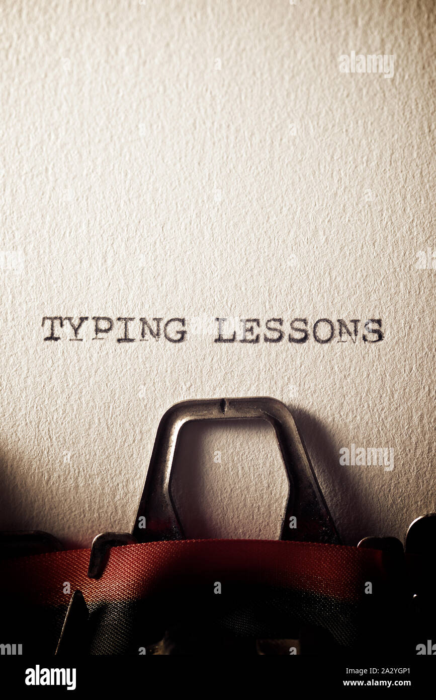 The sentence, Typing Lessons, written with a typewriter Stock Photo - Alamy