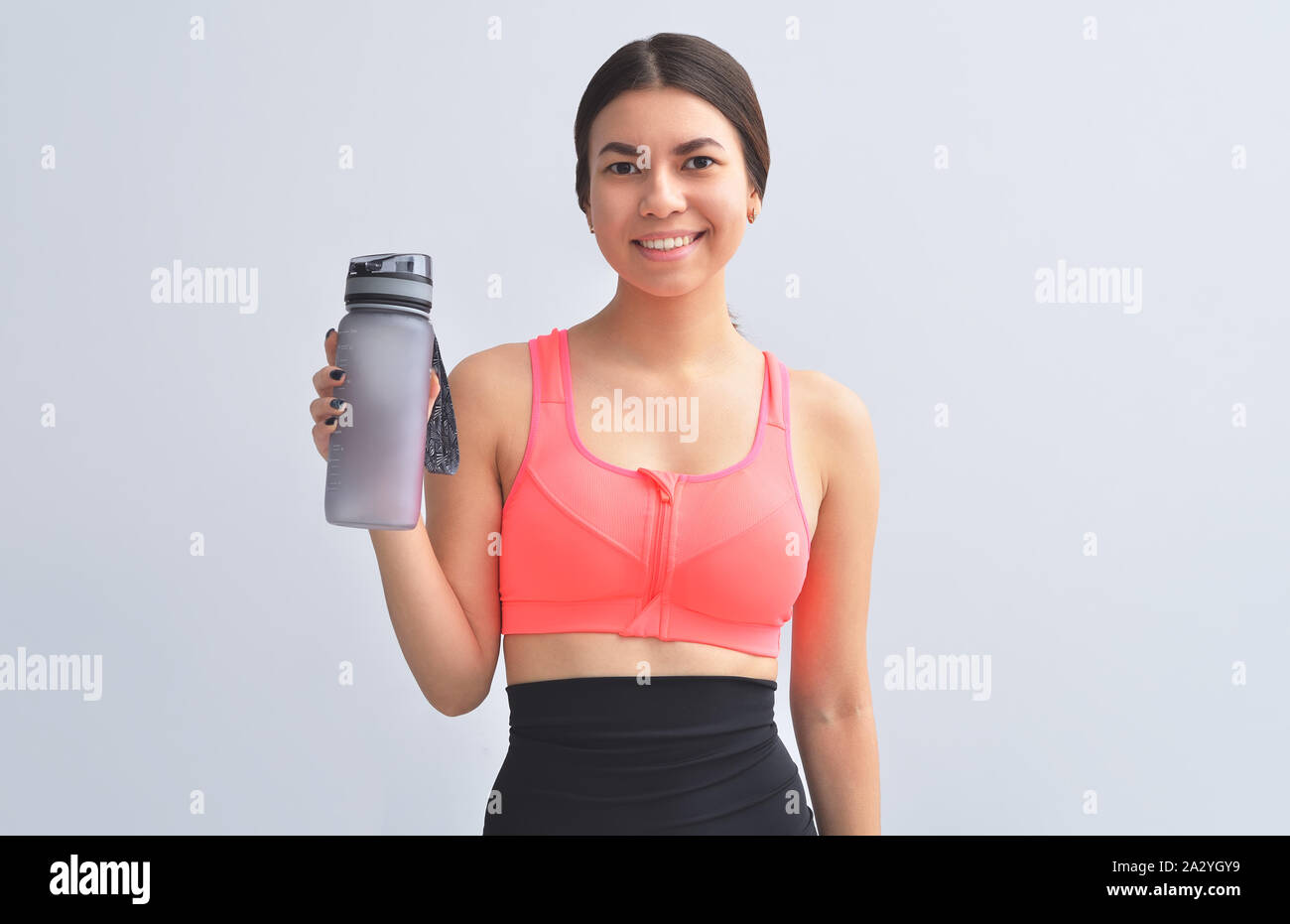 Restoring Water Balance Attractive And Young Woman In Sports Wear