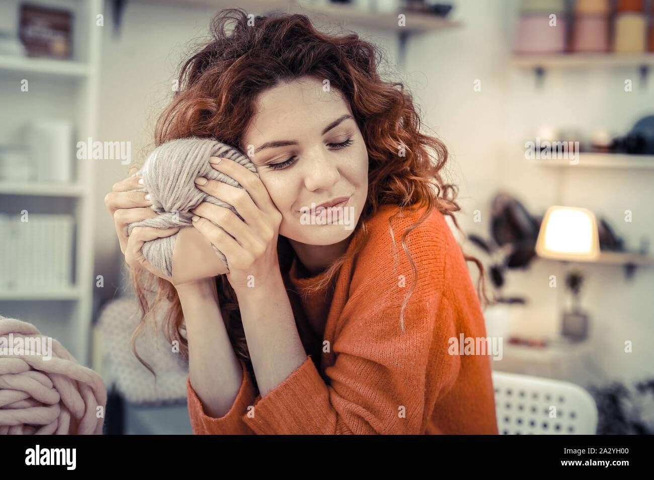 Beautiful smiling woman turning on her imagination Stock Photo - Alamy