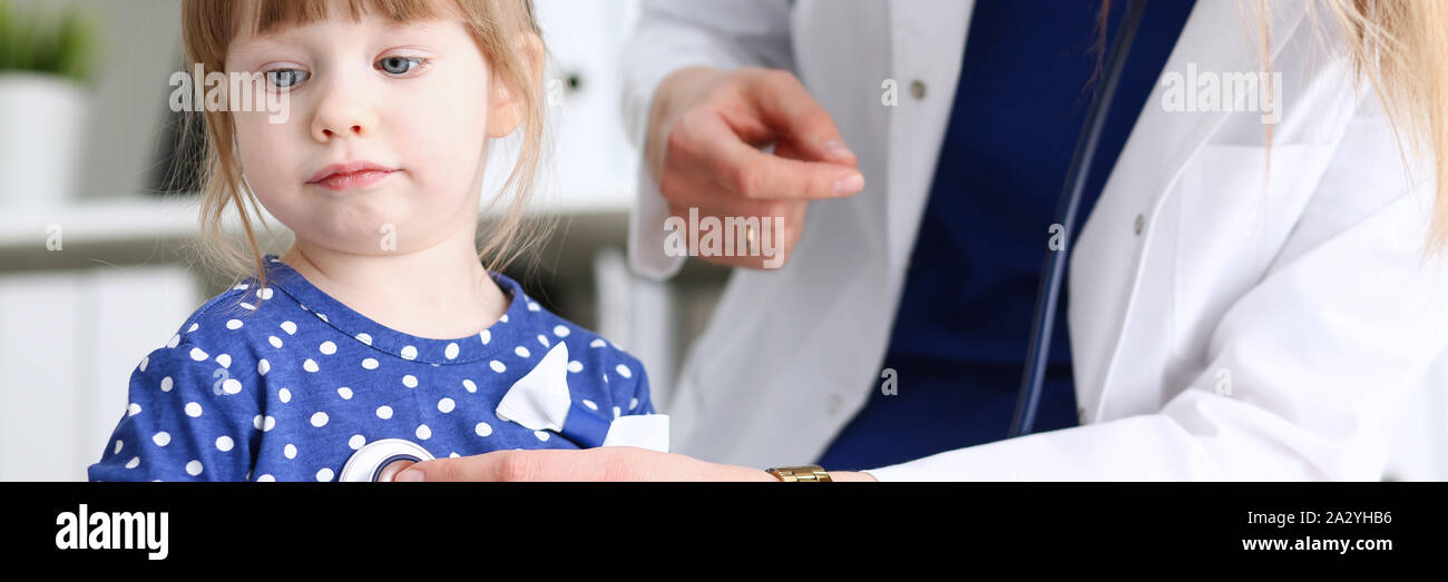 Little child with stethoscope at doctor reception Stock Photo - Alamy