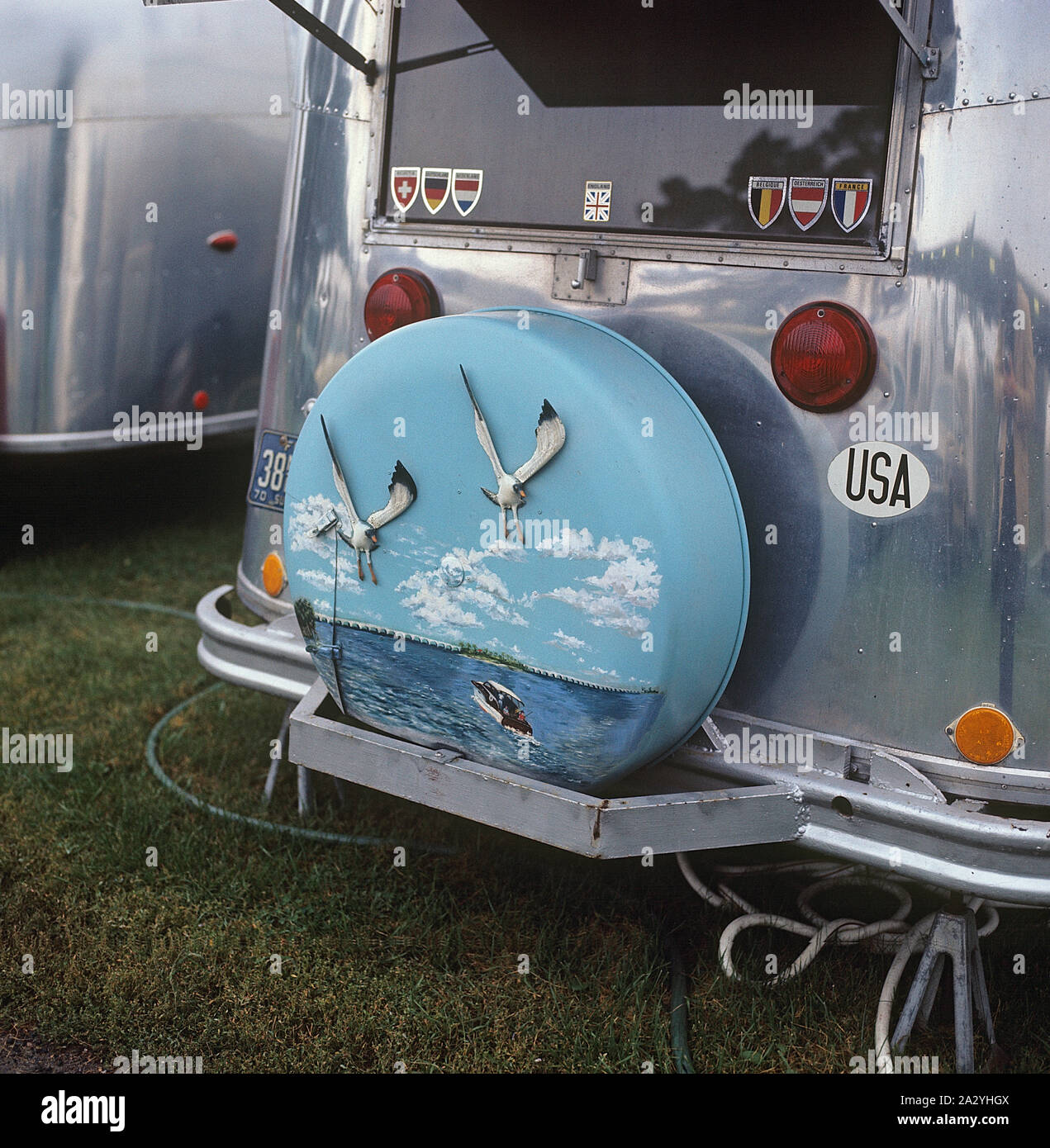 1970s camping. Pictured an American Airstream caravan in aluminium and ...