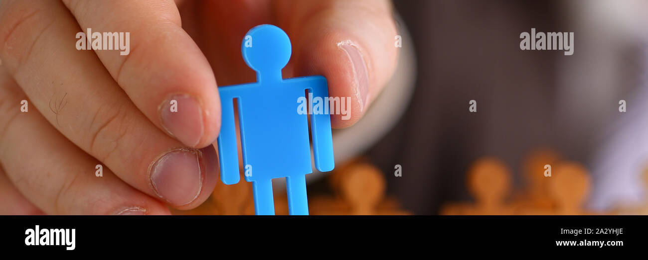 Man arm in suit take little plastic toy figure Stock Photo - Alamy