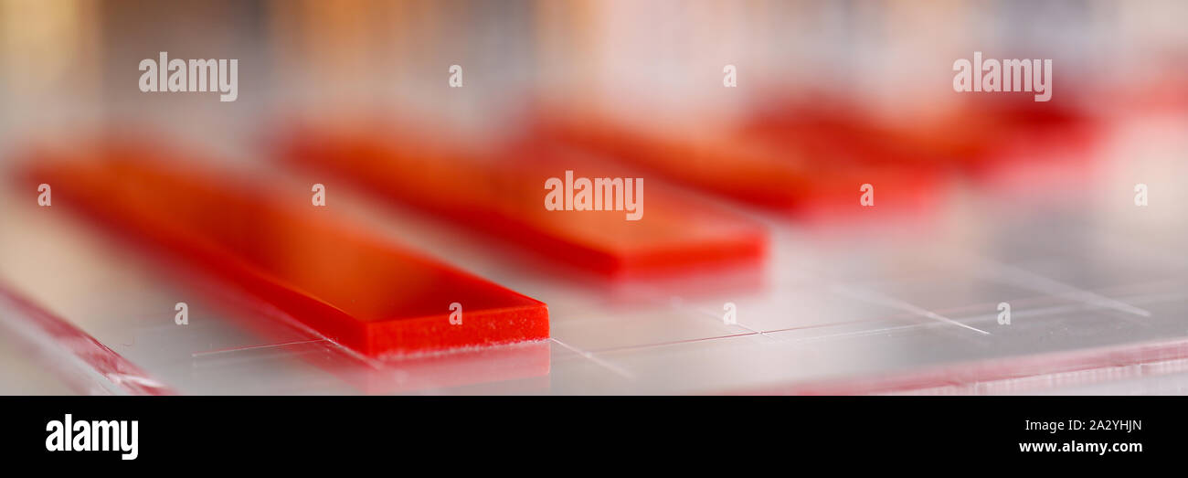 Red plastic graph columns on table Stock Photo - Alamy
