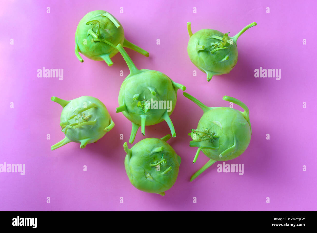 Fresh green kohlrabi on pink background.Kohlrabi or German turnip or ...