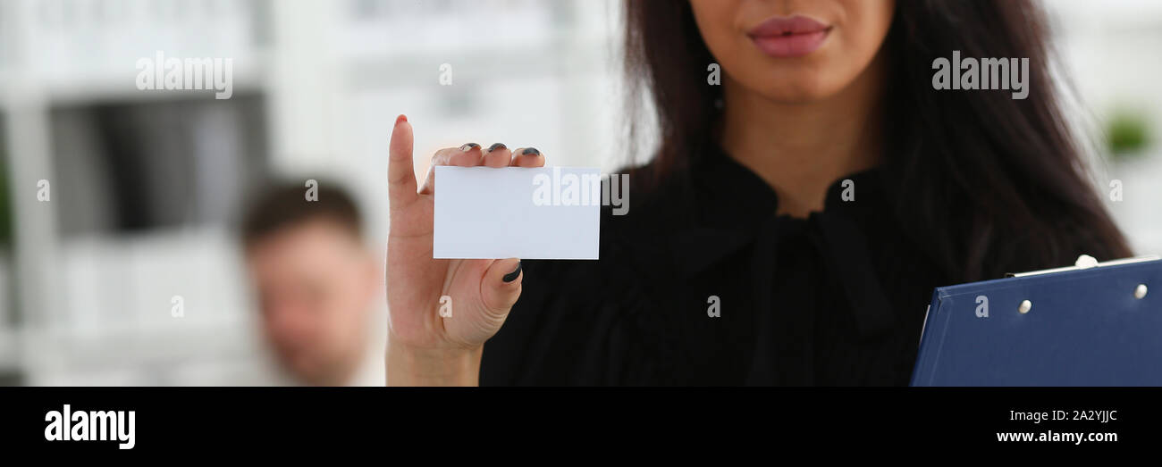 Female arm give blank calling card to visitor Stock Photo - Alamy