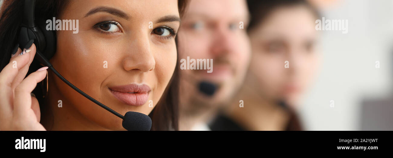 Three call centre service operators at work Stock Photo - Alamy