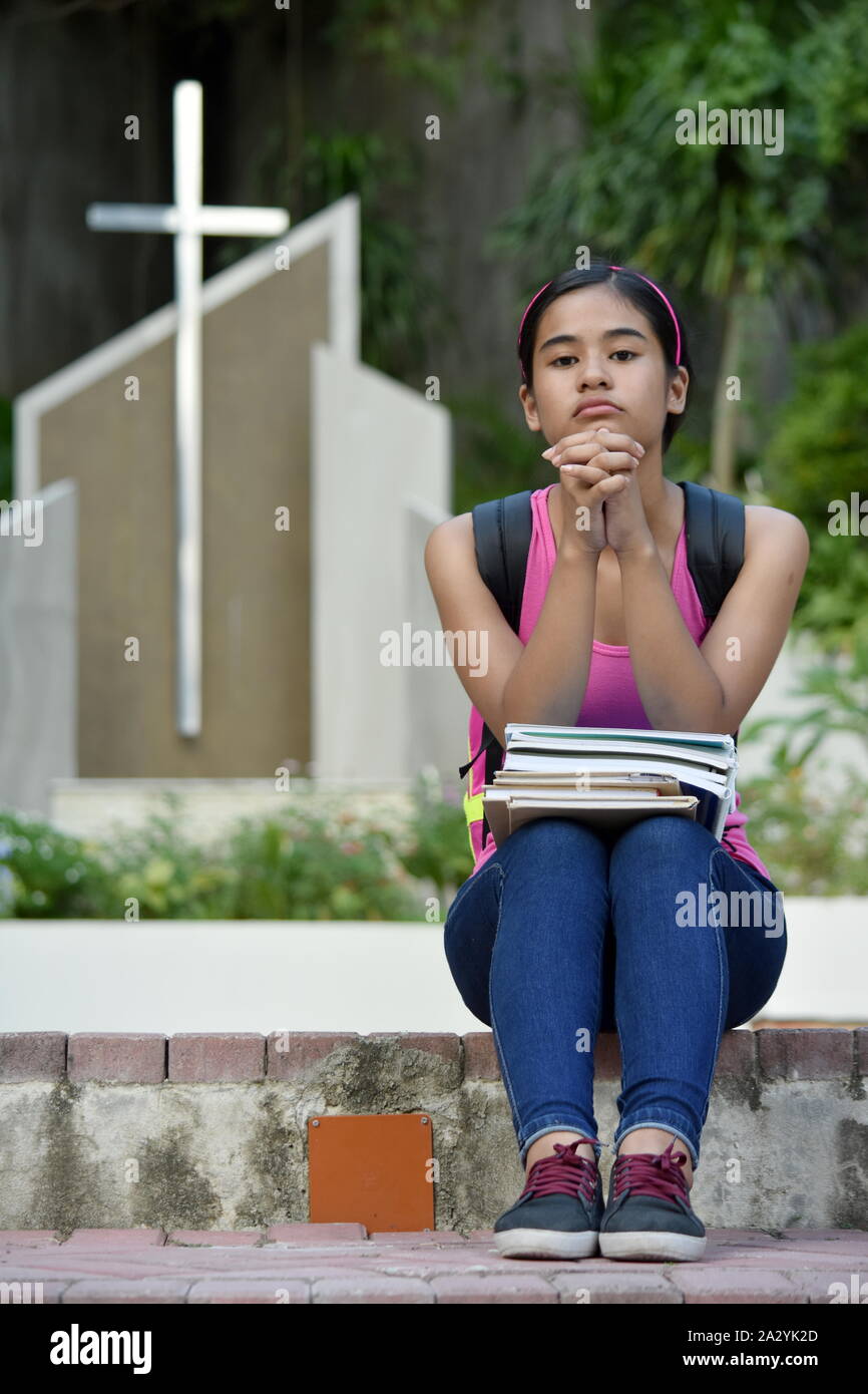Beautiful girl praying in church hi-res stock photography and images ...