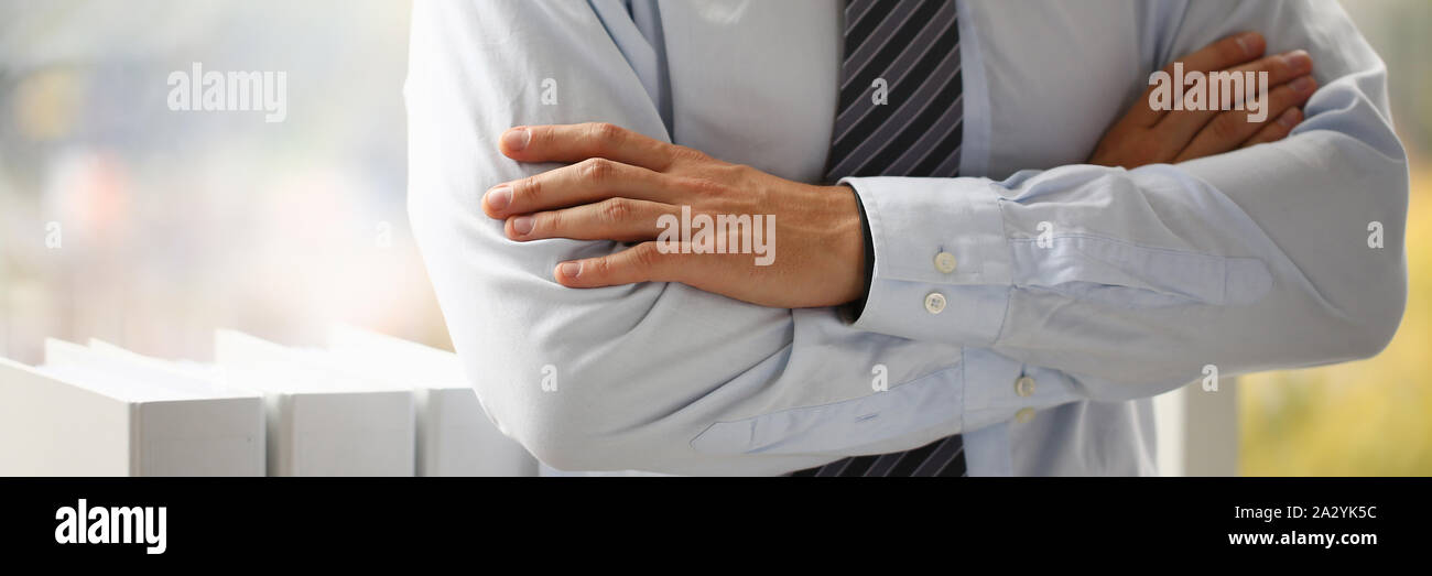 Male hands in suit crossed on chest closeup background Stock Photo - Alamy