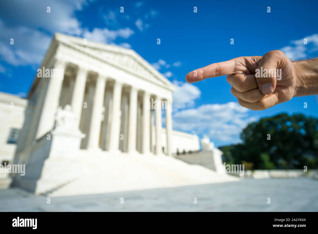 American hand pointing index finger at the US Supreme Court building in ...