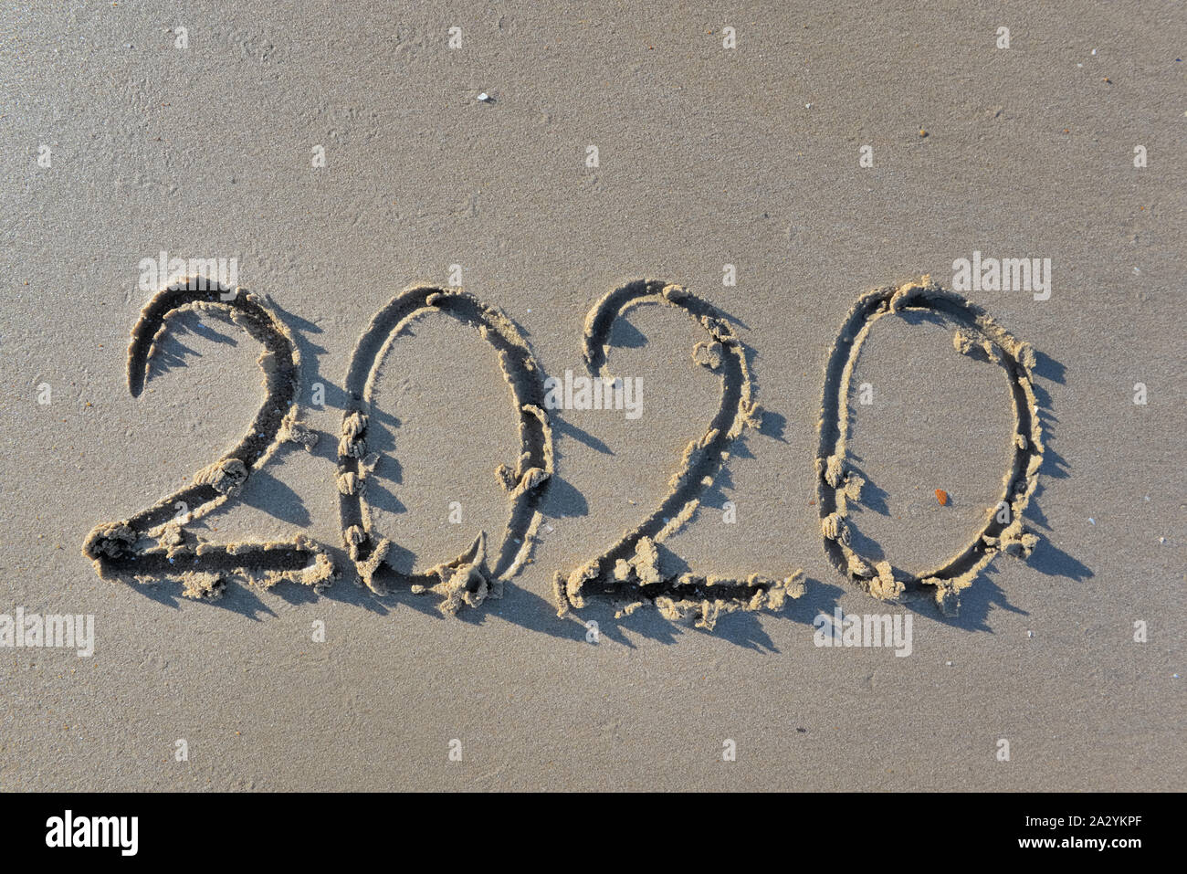 2020 handwritten on the sand Stock Photo - Alamy