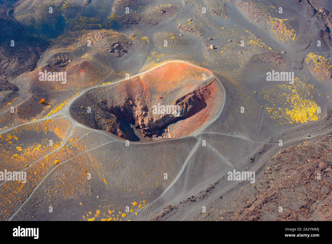 Volcanic crater on the side of the mountain, around hardened lava ...