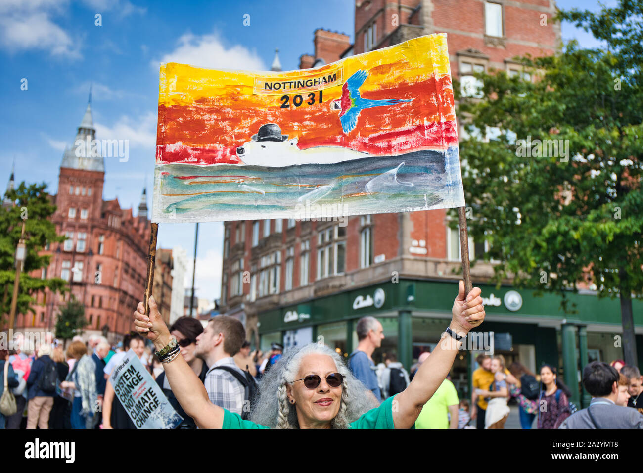 Woman holding up climate change banner at the 20th September global ...