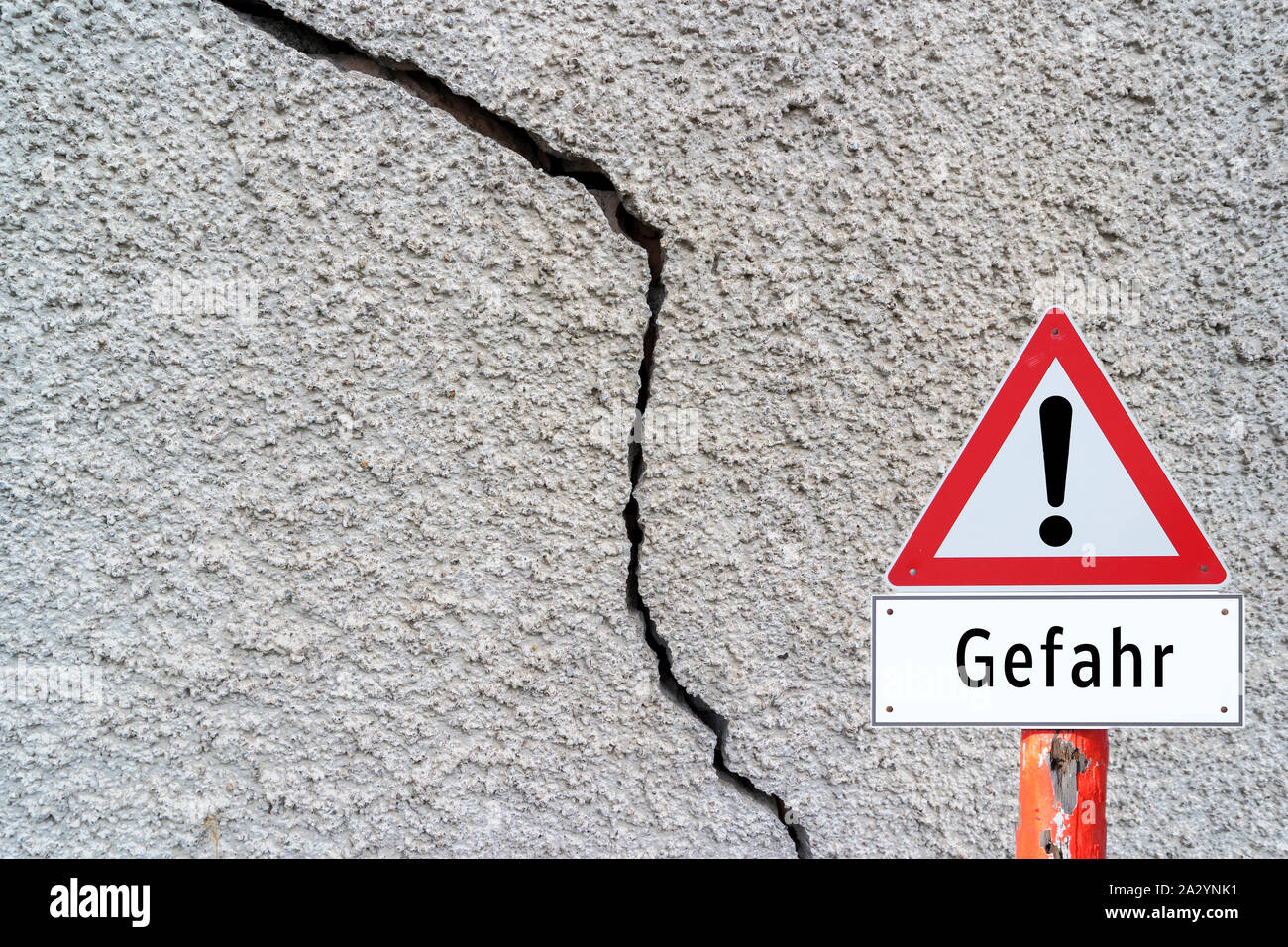 crack wall danger sign Stock Photo - Alamy