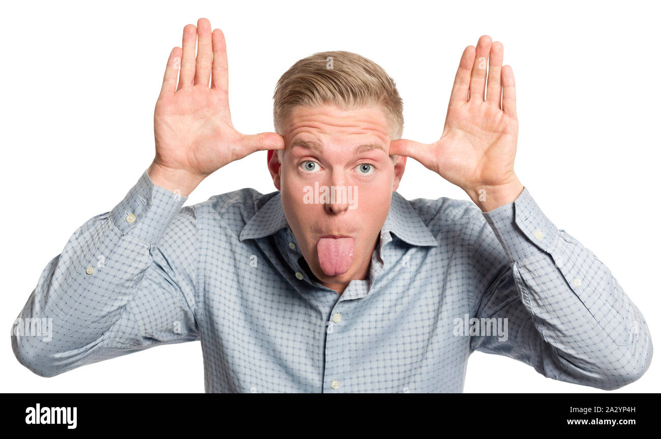 Playful businessman making foolish expression Stock Photo - Alamy