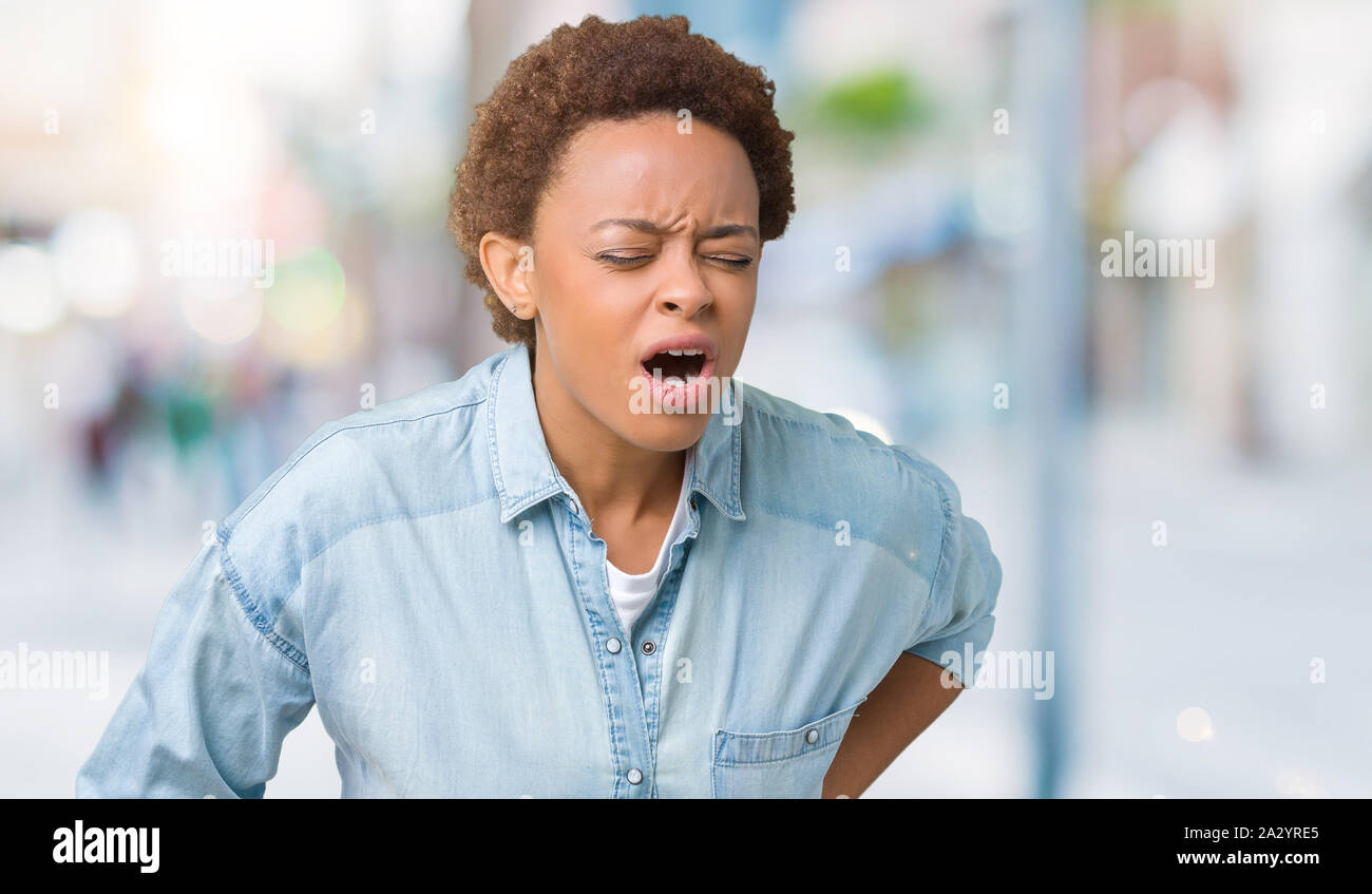 Young beautiful african american woman over isolated background with ...