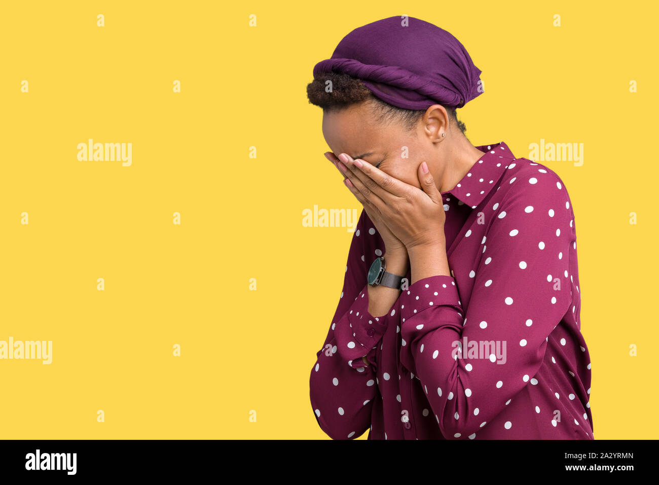 Beautiful young african american woman wearing head scarf over isolated ...