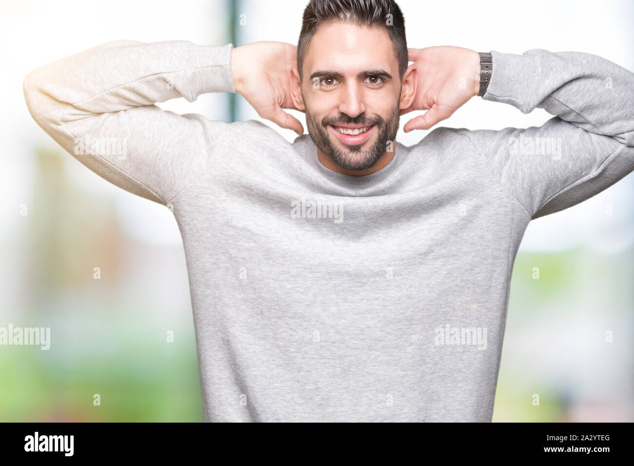 Male model arms behind head hi-res stock photography and images - Alamy