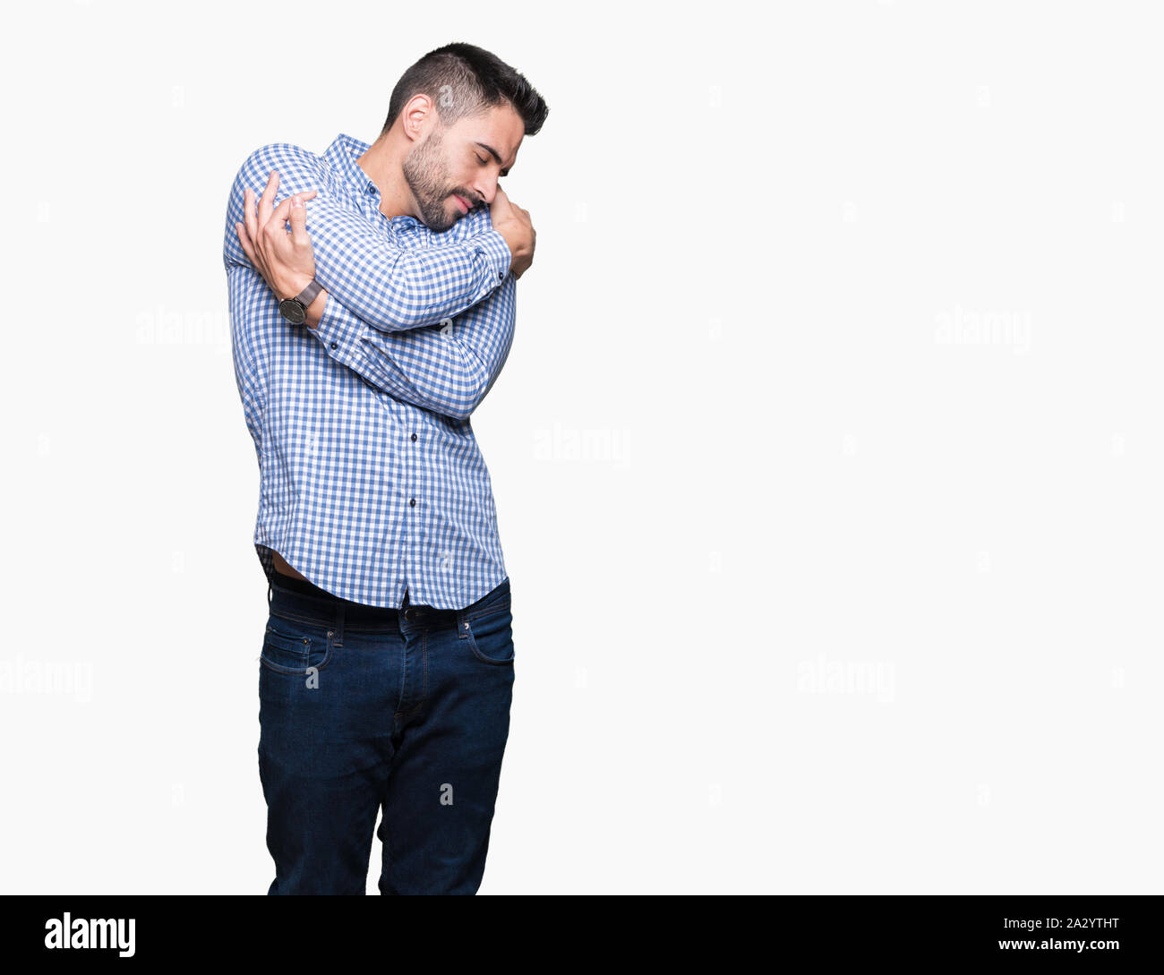 Young handsome man over isolated background Hugging oneself happy and ...