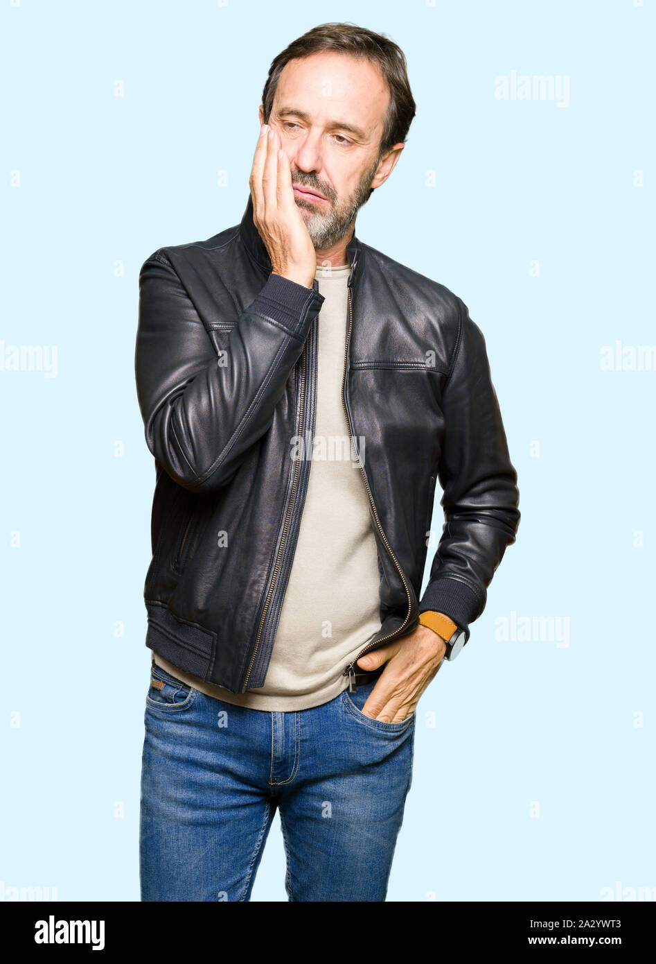 Middle age handsome man wearing black leather jacket thinking looking ...